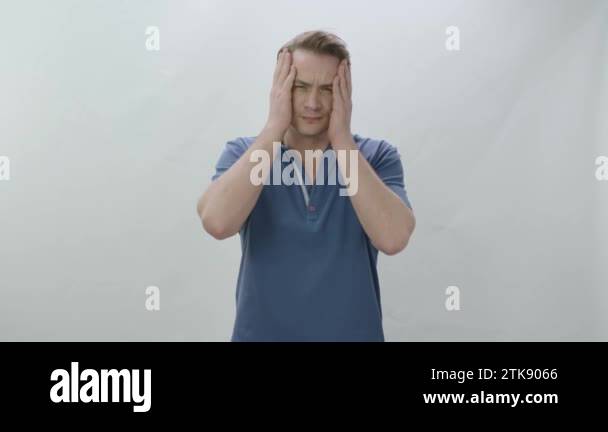 Young man isolated on white background showing boring facial ...