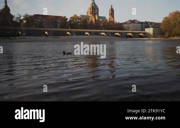 St. Luke Church near Isar river and Wehrsteg bridge, Munich, Germany ...