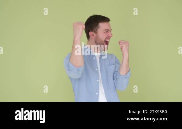 An explosion of positive emotions of a young student. The young man ...