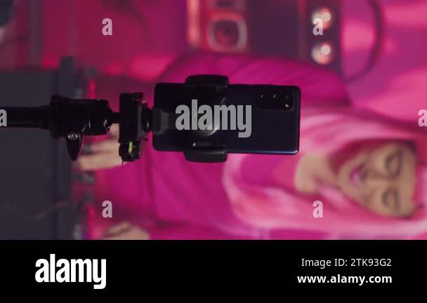 Vertical video: Musician recording music session with phone camera ...