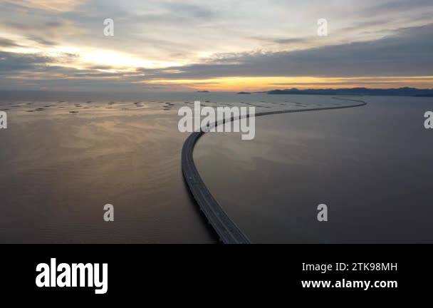 Drone shot hyperlapse Penang Second Bridge in sunset hour. Aerial car ...