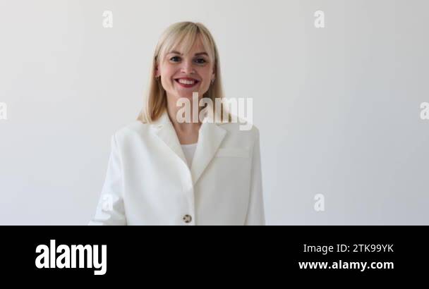 An attractive woman is seen on a white background, showcasing the OK ...
