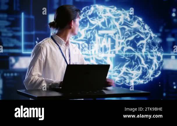 Admin using laptop to visualize artificial intelligence neural networks ...