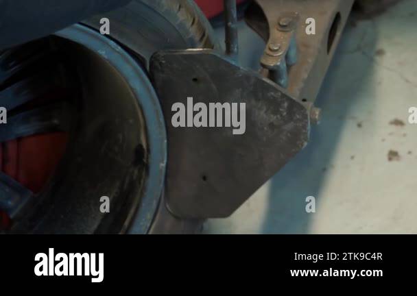 Tyre Fitting. Mechanic using hydraulic or mechanical press to remove ...