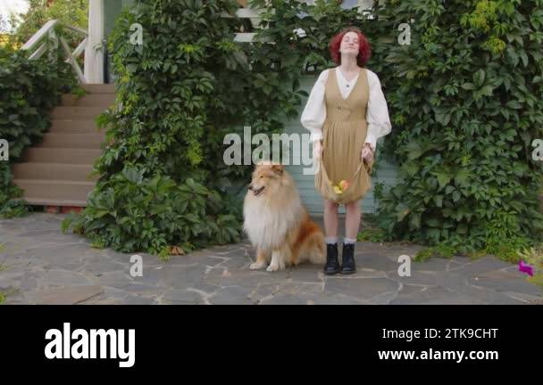 Long shot of joyful gen Z girl wearing vintage outfit holding apples in ...