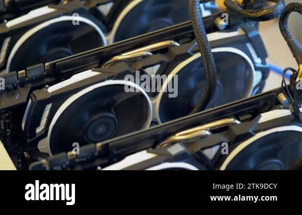 A farm of video cards for a mining rig. Cryptocurrency mining equipment ...