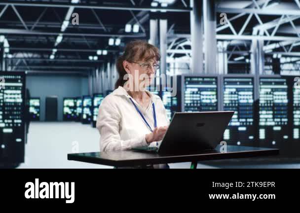 Licensed worker working in server room housing GPU dedicated supercomputers that can process AI ...