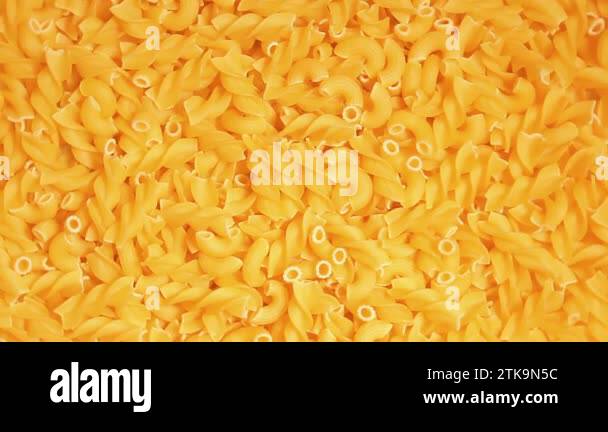 Uncooked Fusilli and Chifferi Rigati Pasta - Top View. Fat and ...