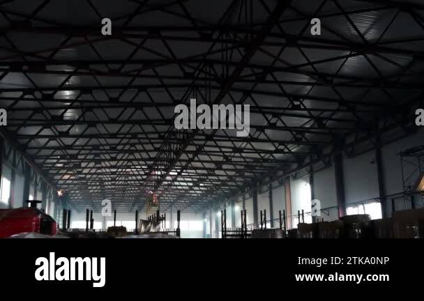 Construction welder works at height. Modern storehouse construction ...