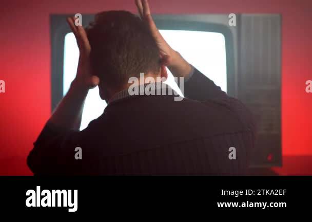 Man in despair holding his hands on head and moving left and right ...