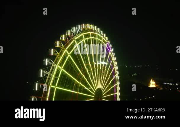 Top view aerial of ferris wheel in amusement park at night. Ferris ...