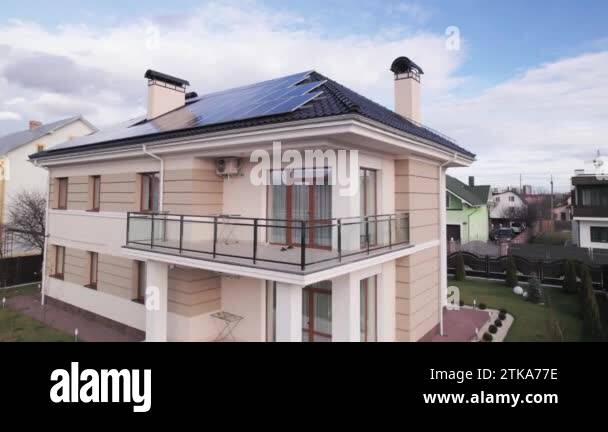 Video footage of modern house with solar panel modules for generating ...