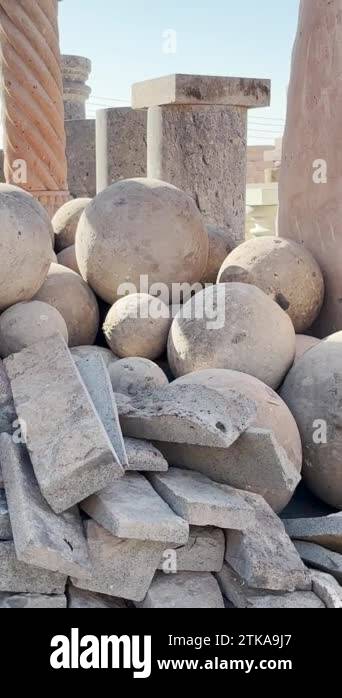 Pink and gray quarry stone, of different shapes and sizes, spheres ...