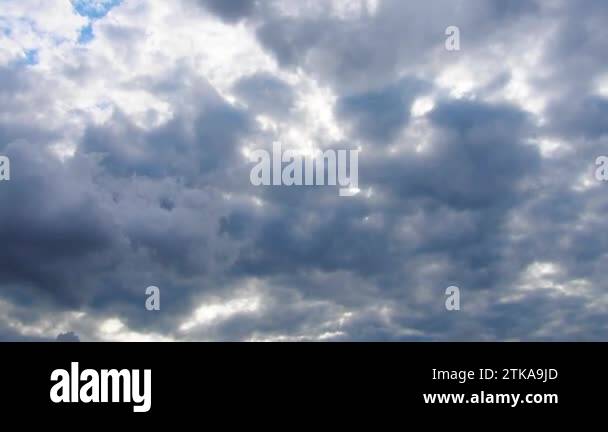 Beautiful clouds in the sky. Volumetric light effect. The sunrays are hidden behind the ...