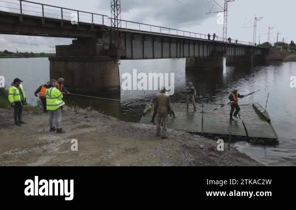 Pontoon bridge of the Ukrainian army. Installation of a temporary ...