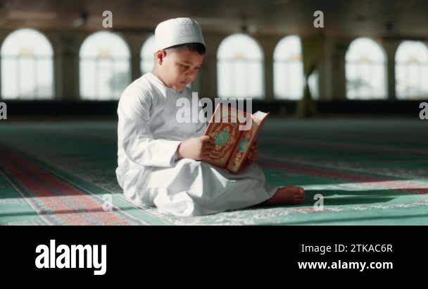 Muslim boy reading quran Stock Videos & Footage - HD and 4K Video Clips ...