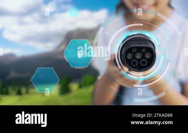 Focus EV charger pointing in front of camera by young girl, display ...