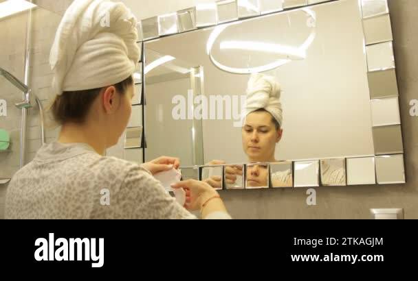 Woman wear moisturizing sheet mask for face. Skincare beauty routine ...