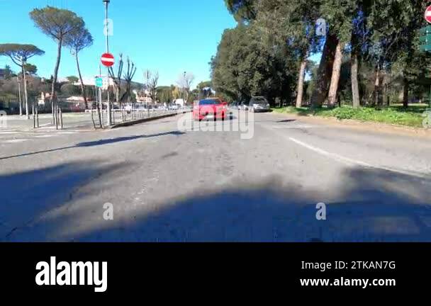 ROME, ITALY - NOVEMBER 7, 2022: Fast driving of exclusive red Ferrari ...