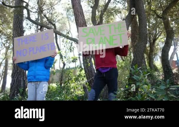 volunteer kids with Save the planet Poster. boy child activist holding ...