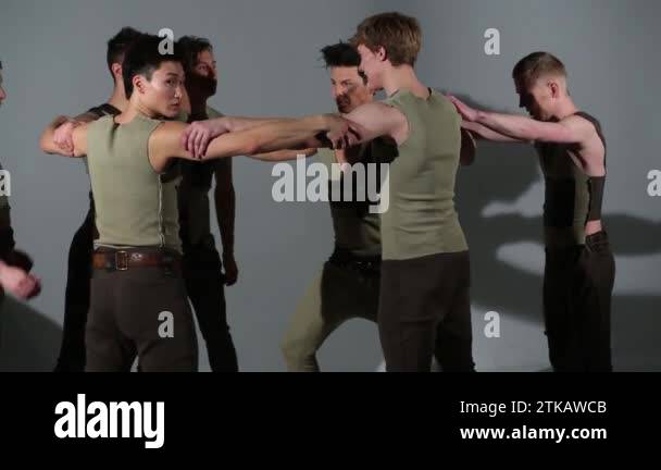 Group of seven men in medieval costumes do acrobatic pyramid Stock ...