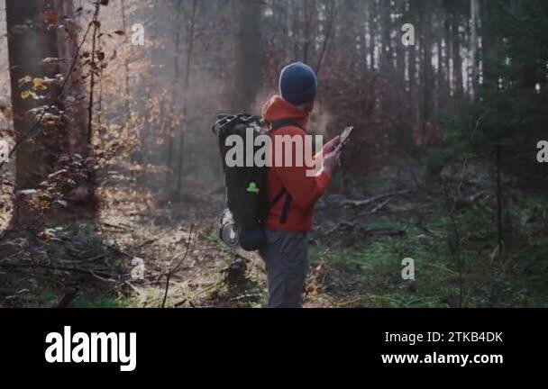 Maps outdoors while hiking. Hiker use smartphone to navigation in ...