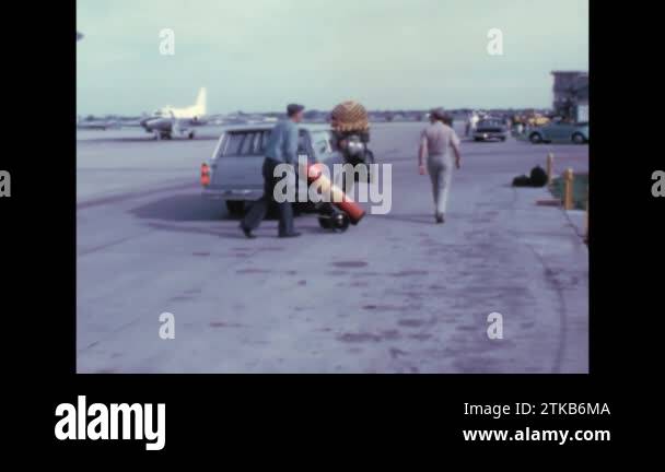 Man pushes a large fire extinguisher used in an airplane fire. Glenview ...