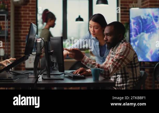 African american and asian people doing teamwork to create engineering ...