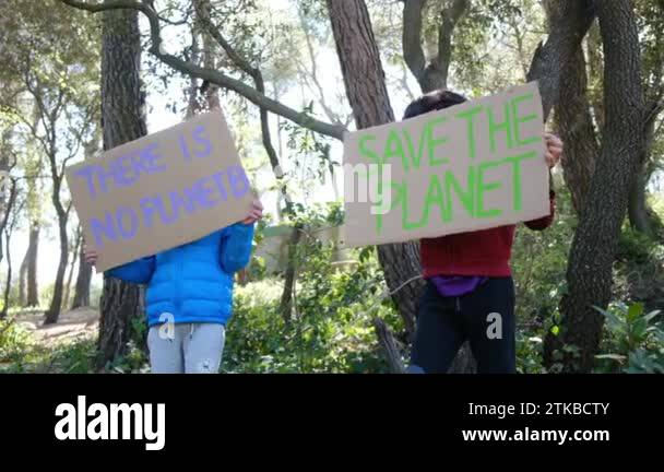 volunteer kids with Save the planet Poster. boy child activist holding ...