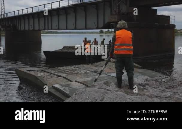 Pontoon bridge of the Ukrainian army. Installation of a temporary ...