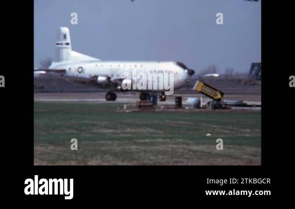 USAF heavy cargo airplane of 1950s 1960s taxiing on military airport ...