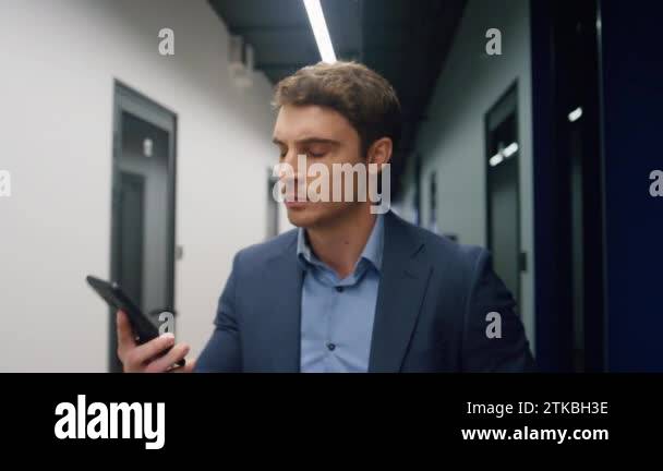 Worried businessman making call leaving office closeup. Stressed ...