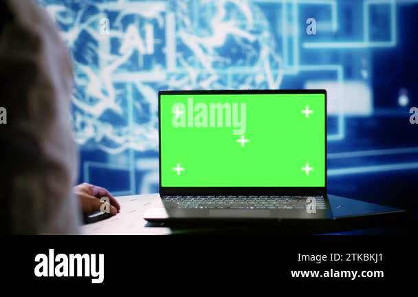 Computer Scientist Using Green Screen Laptop To Implement Artificial Intelligence Parallel