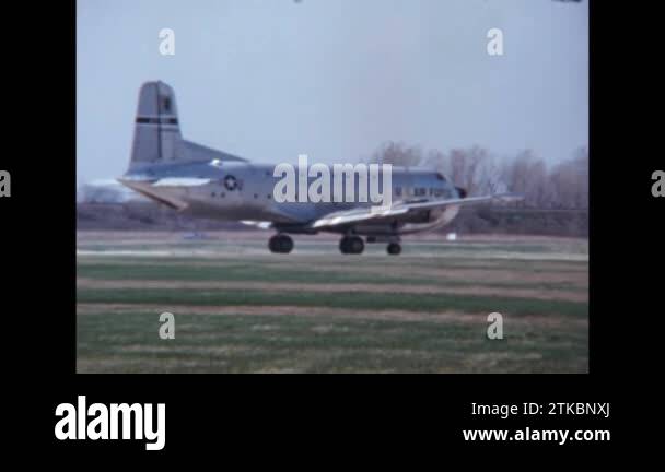 Heavy transport military aircraft with four propeller engines lines up ...