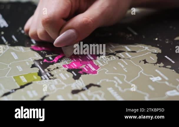 Female Hand Scratching Europe countries on the Surface of Scratch World ...