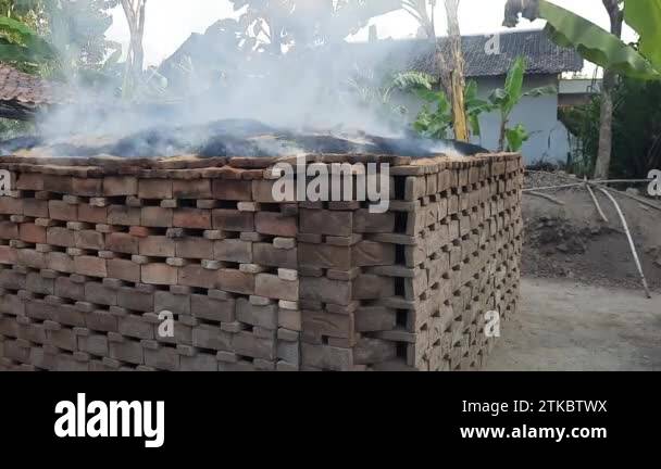 Red brick from clay. The process of making bricks in rural Indonesia ...
