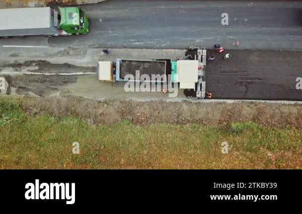 Pavement machine laying fresh asphalt Stock Videos & Footage - HD and ...
