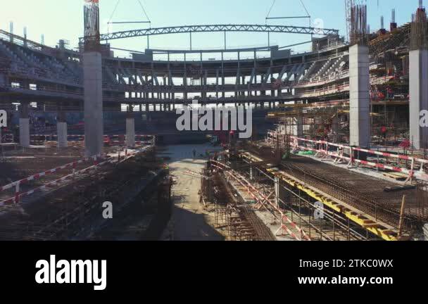 Metal structures and concrete foundation of modern stadium in process ...