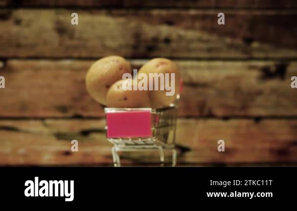 Slide camera Potatoes in their skins on a rotary table against the ...