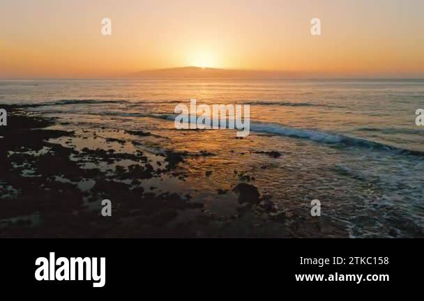 Beautiful sunset over the sea. Solar path on the surface of the salty ...