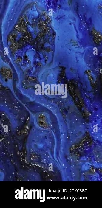 Vertical video. Sparkling fluid. Paint blend. Marble texture. Defocused ...