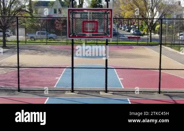 This video shows views of an empty basketball court with rims removed ...