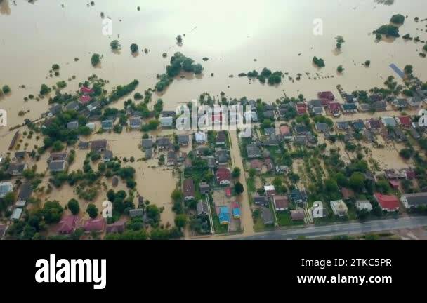 Destruction, heavy rain, flood water. Flood affected house on streets ...