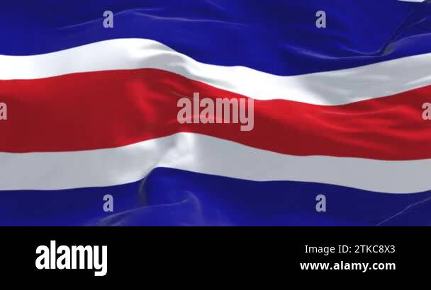 Costa Rica national civil flag waving in the wind. Blue, white, red ...
