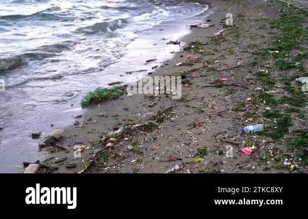 Plastic waste on beach. non-biodegradable waste on beach. Spilled ...