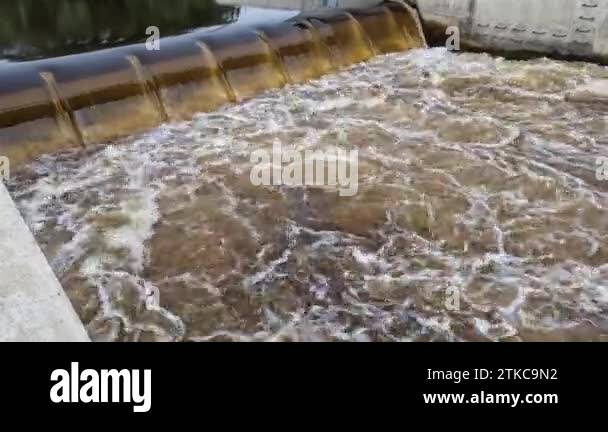 dangerous weirs with cylindrical overflows. an eddy on the water with ...