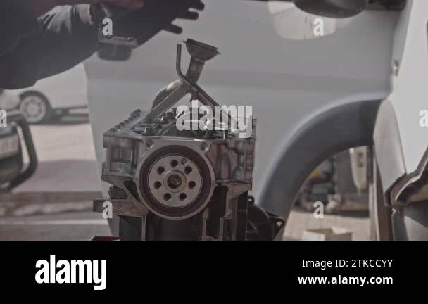 Repair Of The Oil Sump Cover Of The Overhauled Car Engine Footage Stock ...