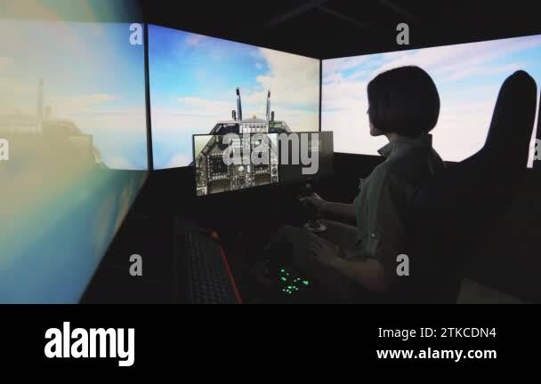 Young female with dark short hair sitting in pilots seat of flight ...