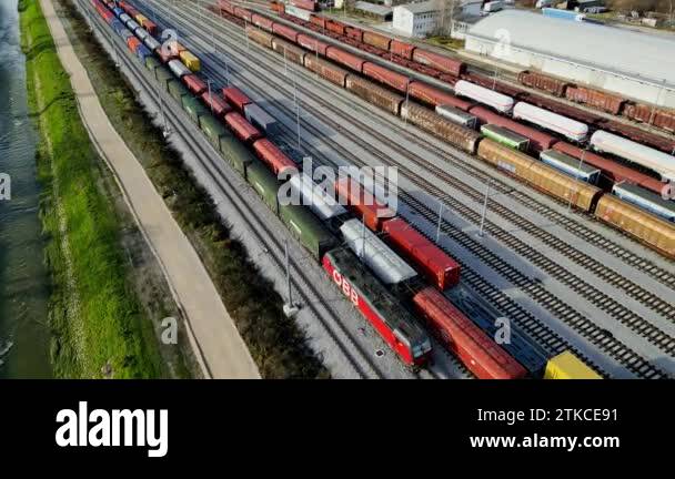 Cargo trains close-up. Aerial view of colorful freight trains on the ...