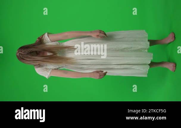 Full-size vertical green screen, chroma key video of a posessed female ...